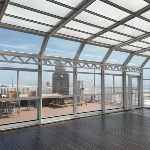 Sunny Atlantic Beach Club Retractable Enclosure by Roll-A-CoverAmerica ...